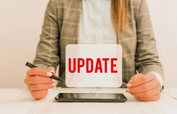 Text sign showing Update. Conceptual photo by adding new information or ...