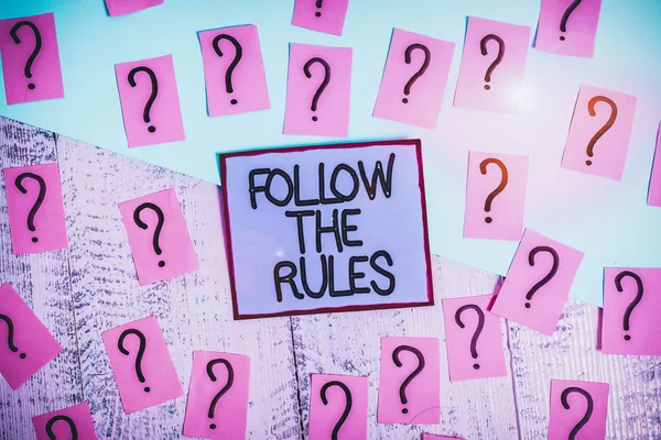 Handwriting text Follow The Rules. Concept meaning order someone stick ...