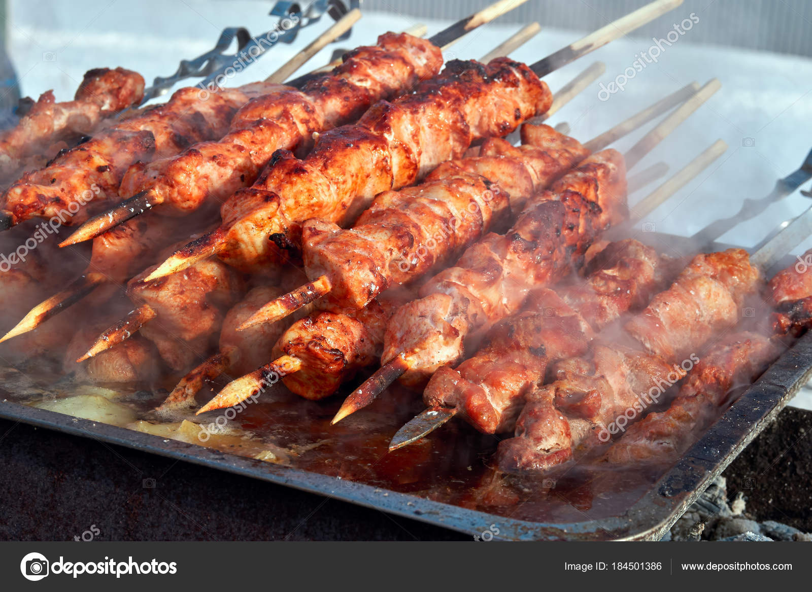 Marinated meat shashlik on preparing on barbecue grill. Roast Beef ...