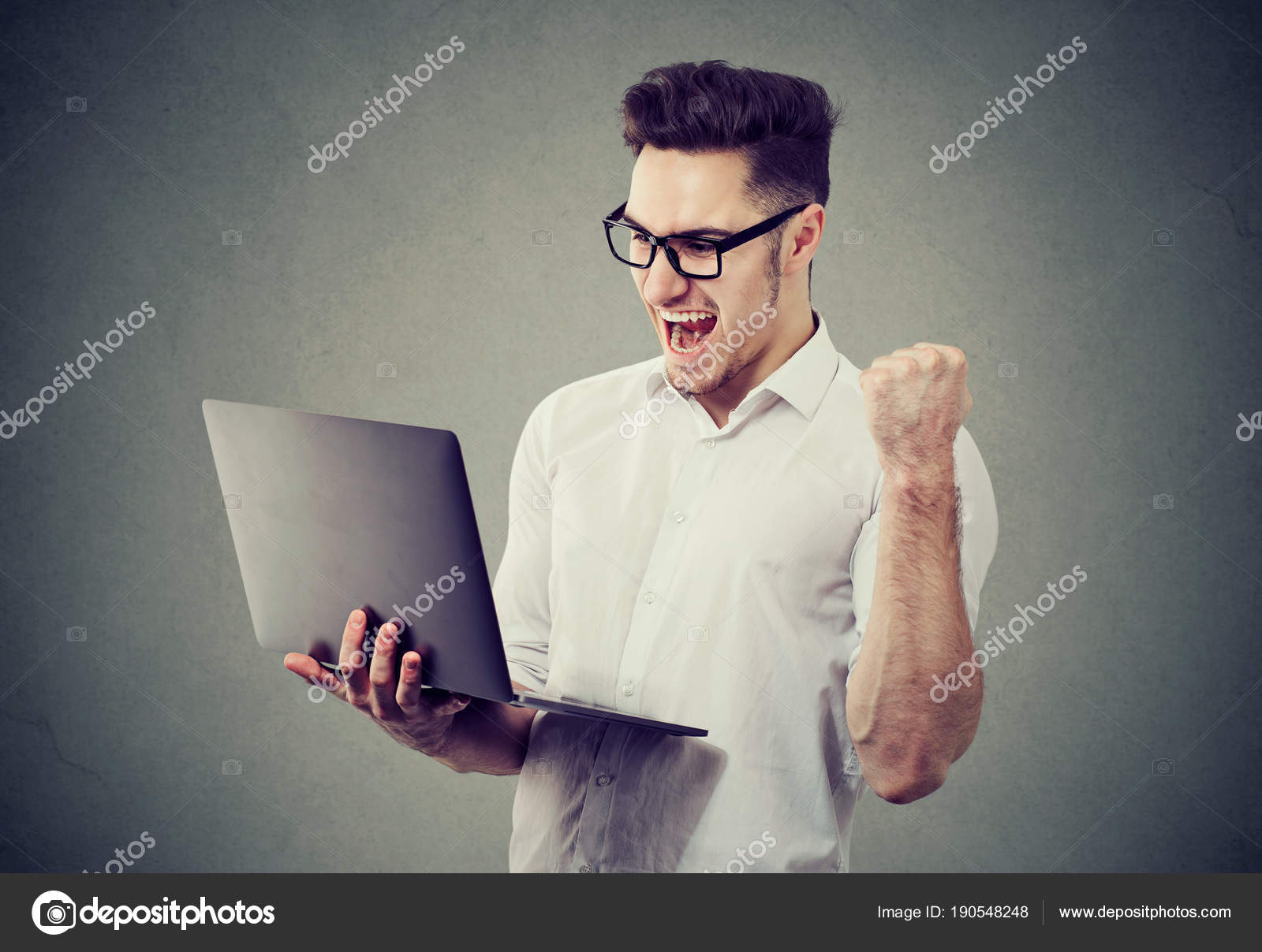 Excited man with laptop computer celebrating success — Stock Photo ...