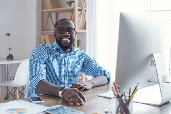 Young african man working in the office business - Stock Image - Everypixel