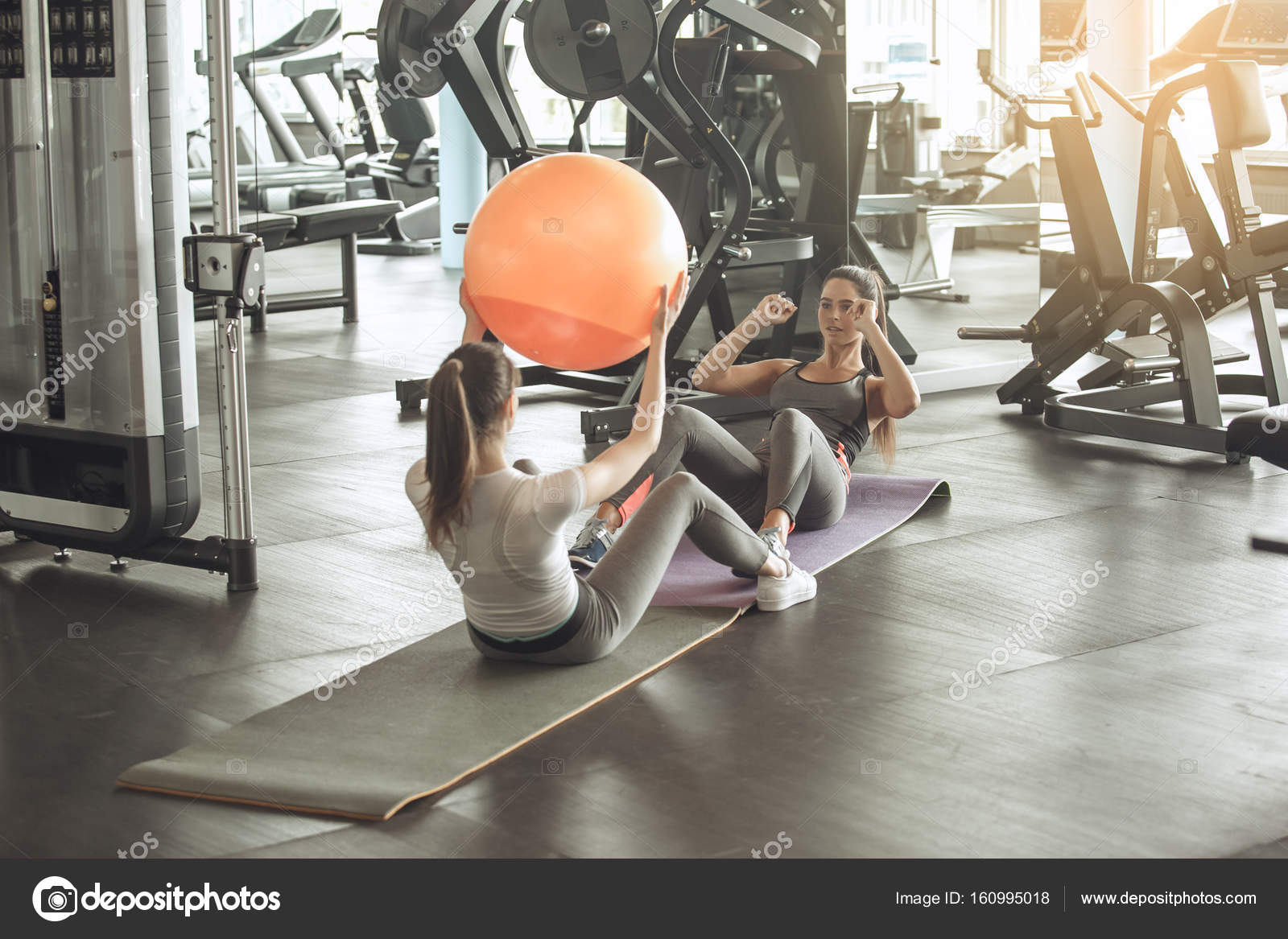 Young women exercise together in the gym Stock Photo by ©dima ...