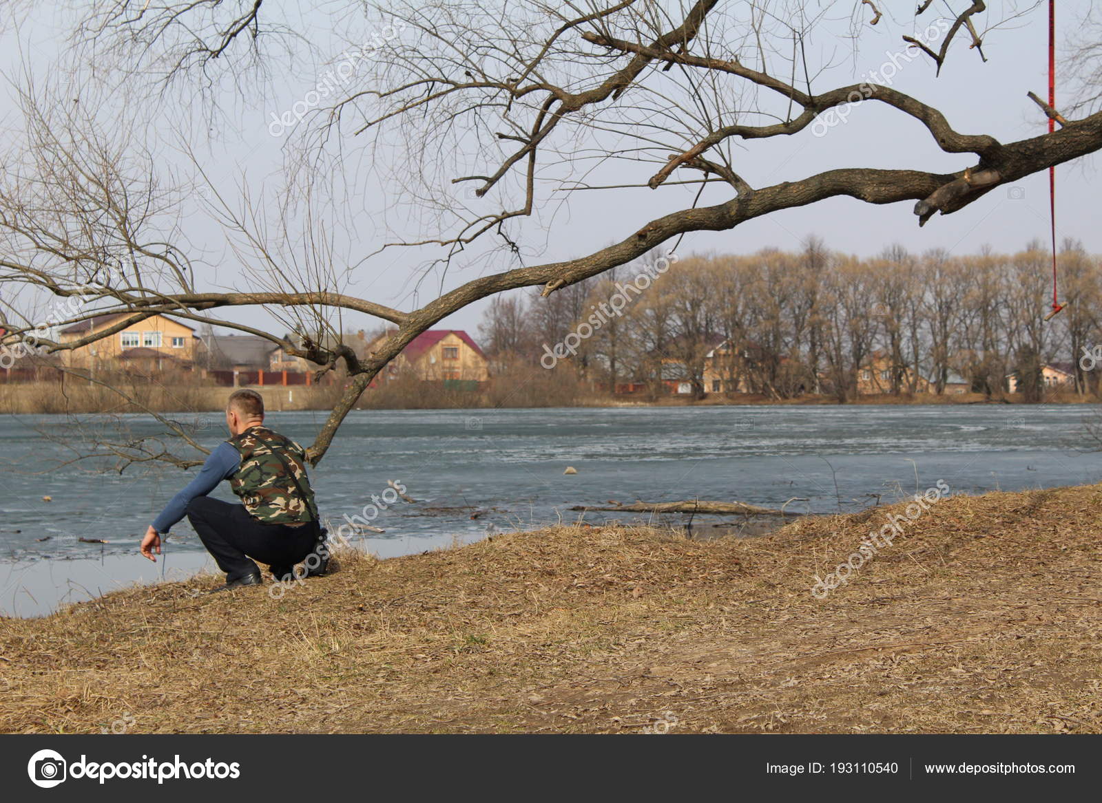 Man Sits His Haunches Lake Early Spring Stares Water Ice — Stock Photo ...