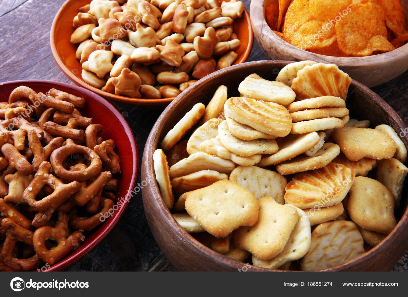 Salty snacks. Pretzels, chips, crackers in wooden bowls. ⬇ Stock Photo ...