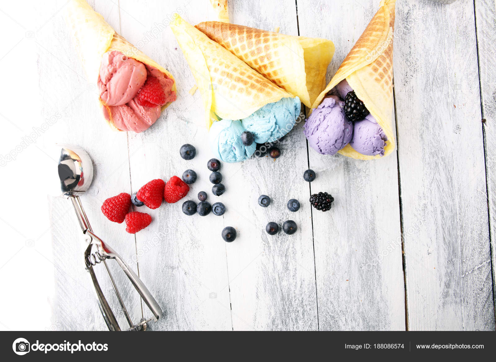 Set of ice cream scoops of different colors and flavours with bl ...