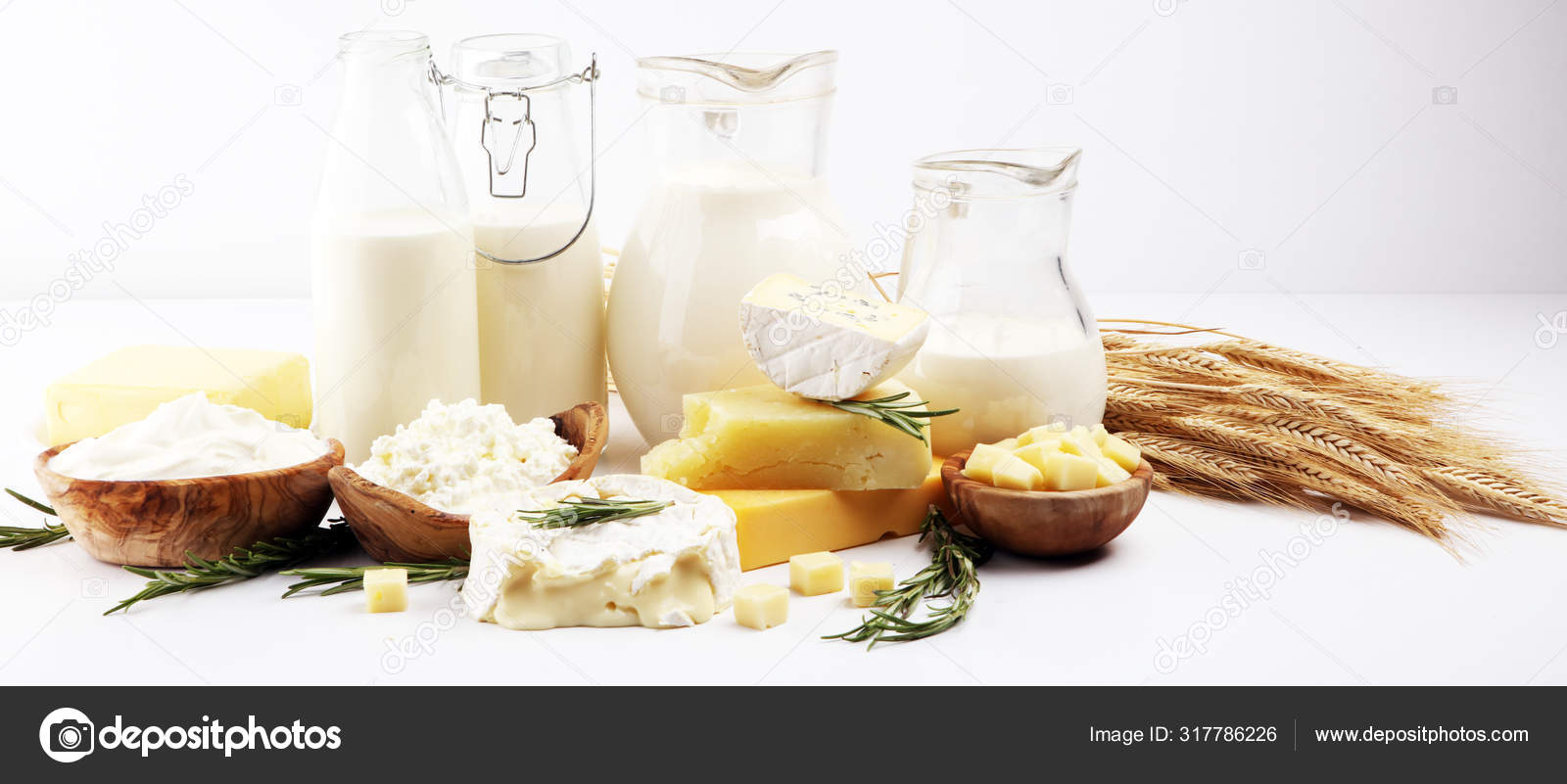 Different healthy dairy products on rustic background with milk — Stock ...