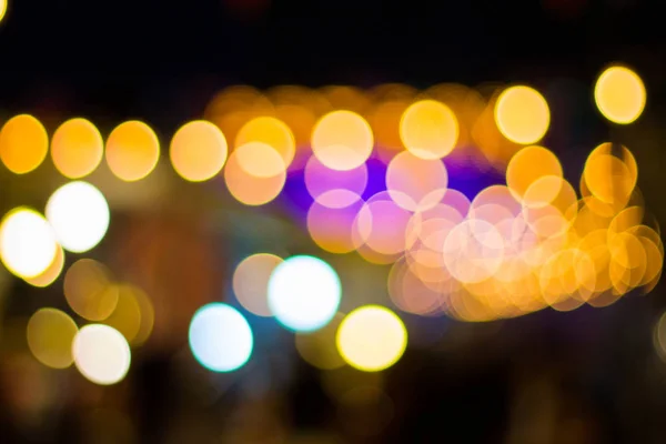 Blur - bokeh Decorative outdoor string lights hanging on tree in the ...