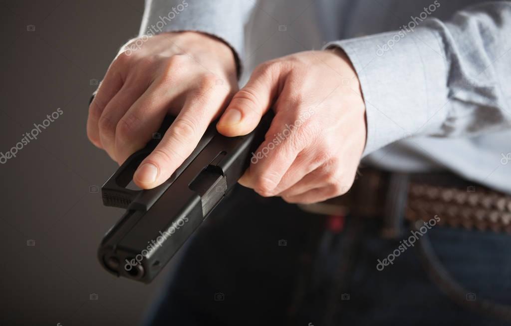 Man reloading pneumatic gun — Stock Photo © zestmarina #167204662