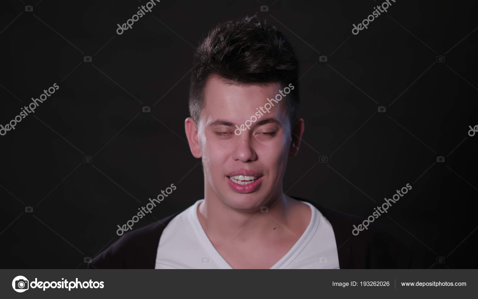 Man Biting his Tongue Against a Black Background — Stock Photo ...