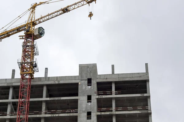 Construction of the frame of high-rise buildings against the overcast ...