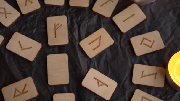 Wooden rune wheel. runic layout and candles, 4k, slow-motion shooting ...