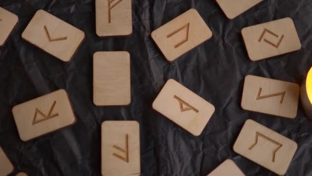 Wooden rune wheel. runic layout and candles, 4k, slow-motion shooting ...