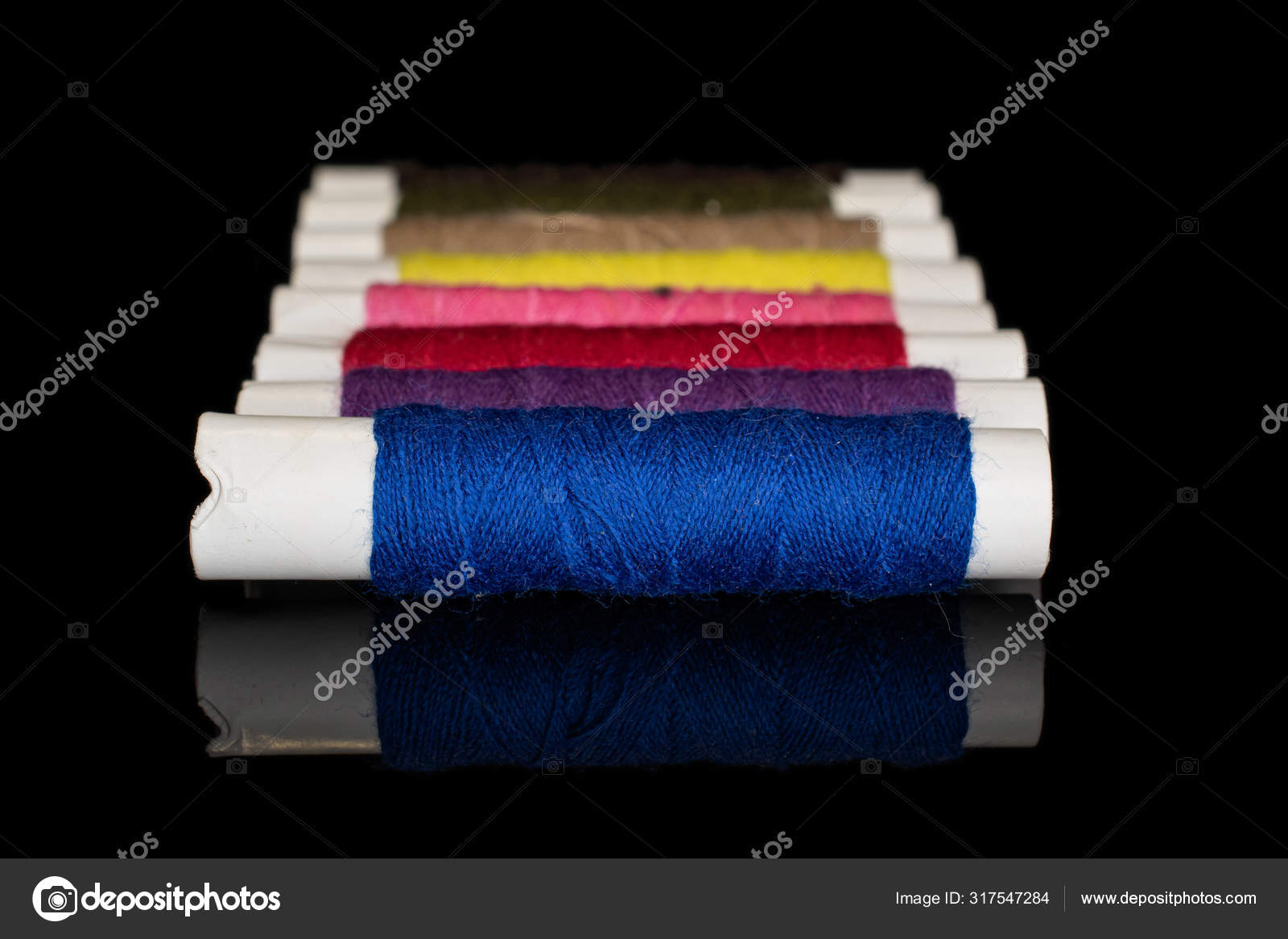 Sewing thread spool isolated on black glass Stock Photo by ©PIXbank ...