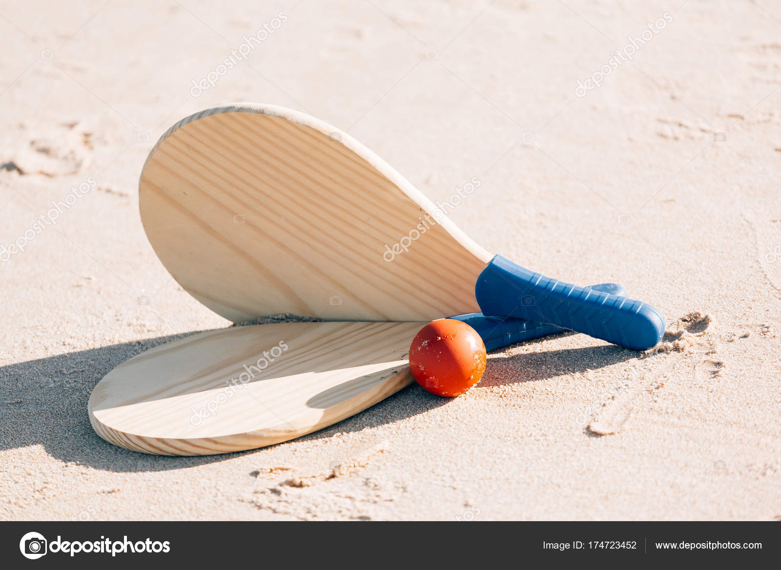 Beach tennis, beach paddle ball, matkot. Beach rackets and ball on the ...