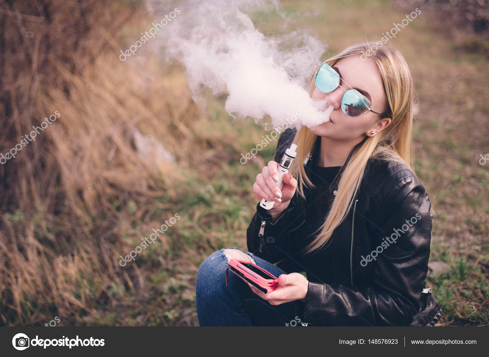 Beautiful Woman Smoking Vaping E Cigarette With Smoke Outdoors