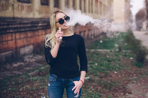 Vaping Young Beautiful Woman Smoking Vaping E Cigarette With Smoke Outdoors Vapor Concept