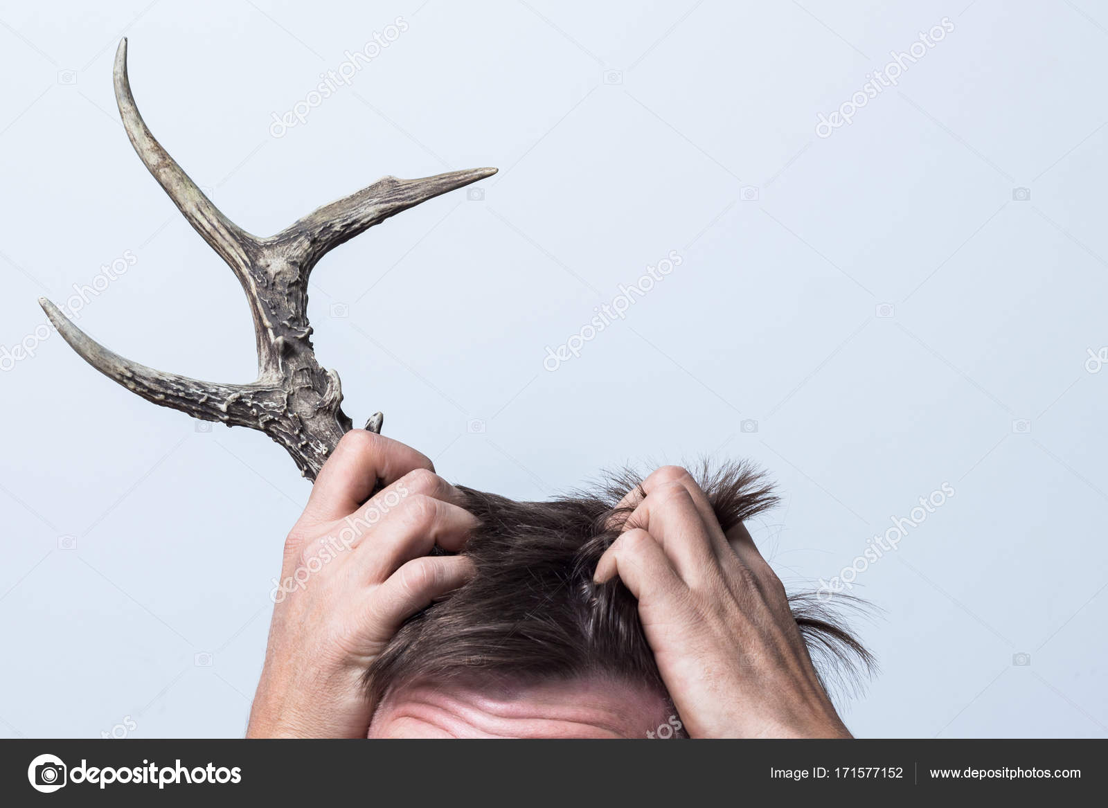 What to do... The man had a horn on his head. Stock Photo by ...