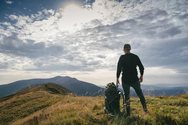 Hiking man or trail runner in mountains, inspirational landscape ...