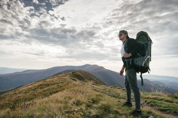 Hiking man or trail runner in mountains, inspirational landscape ...