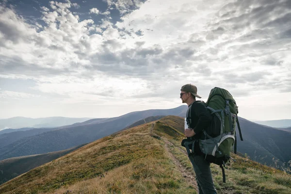 Hiking man or trail runner in mountains, inspirational landscape ...
