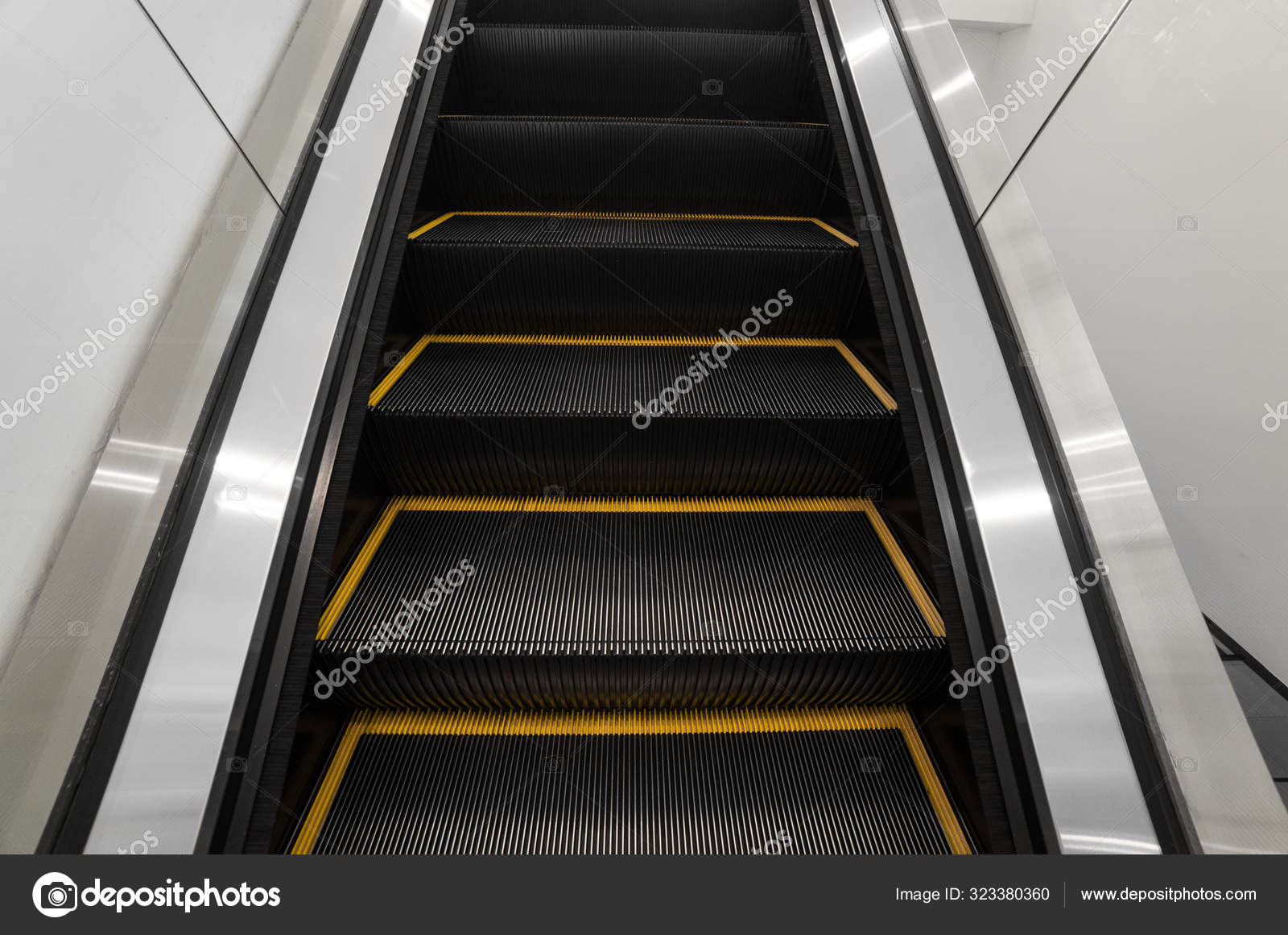 Modern escalator electronic system moving. Escalator is moving up.The ...