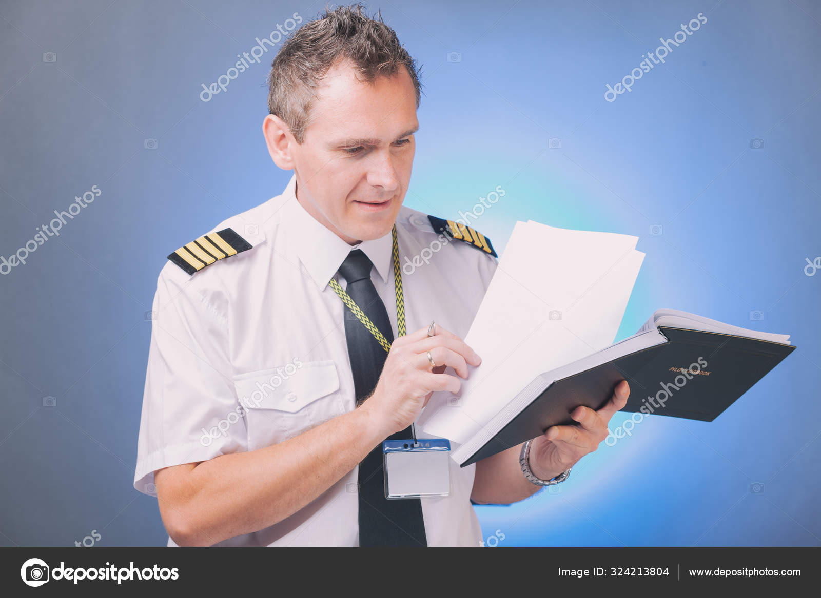 Pilot filling in logbook and checking papers Stock Photo by ©Amaviael ...