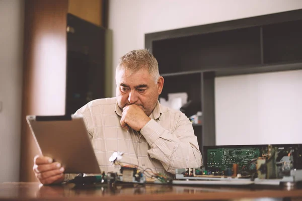 Man fixes electronics Stock Photo by ©bugarskipavle3.gmail.com 173659856
