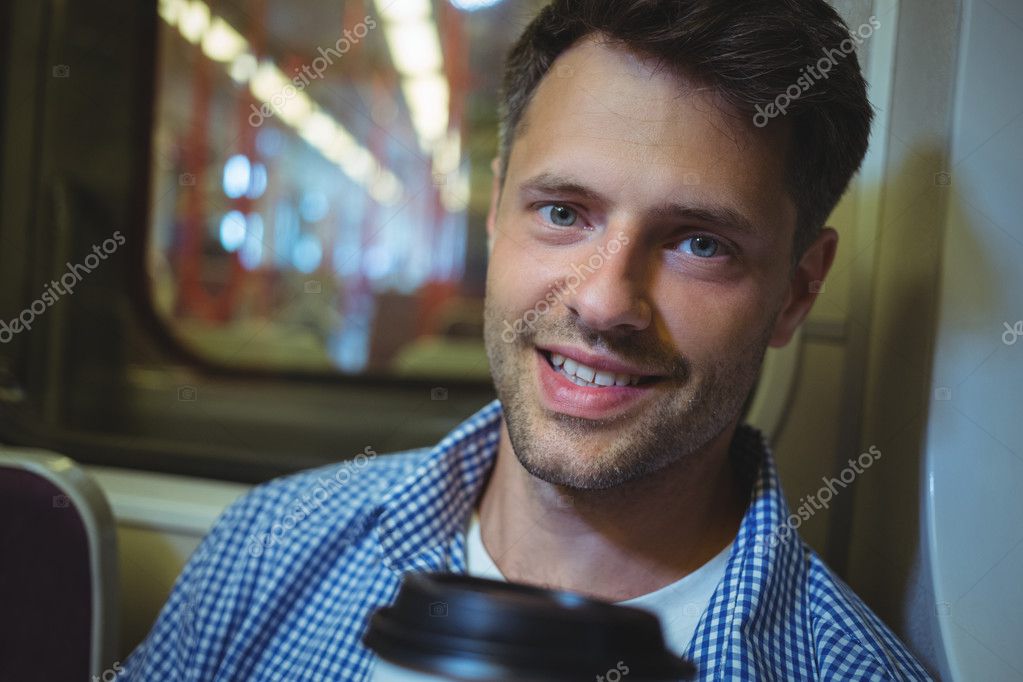 Handsome man travelling in train — Stock Photo © Wavebreakmedia #126920140