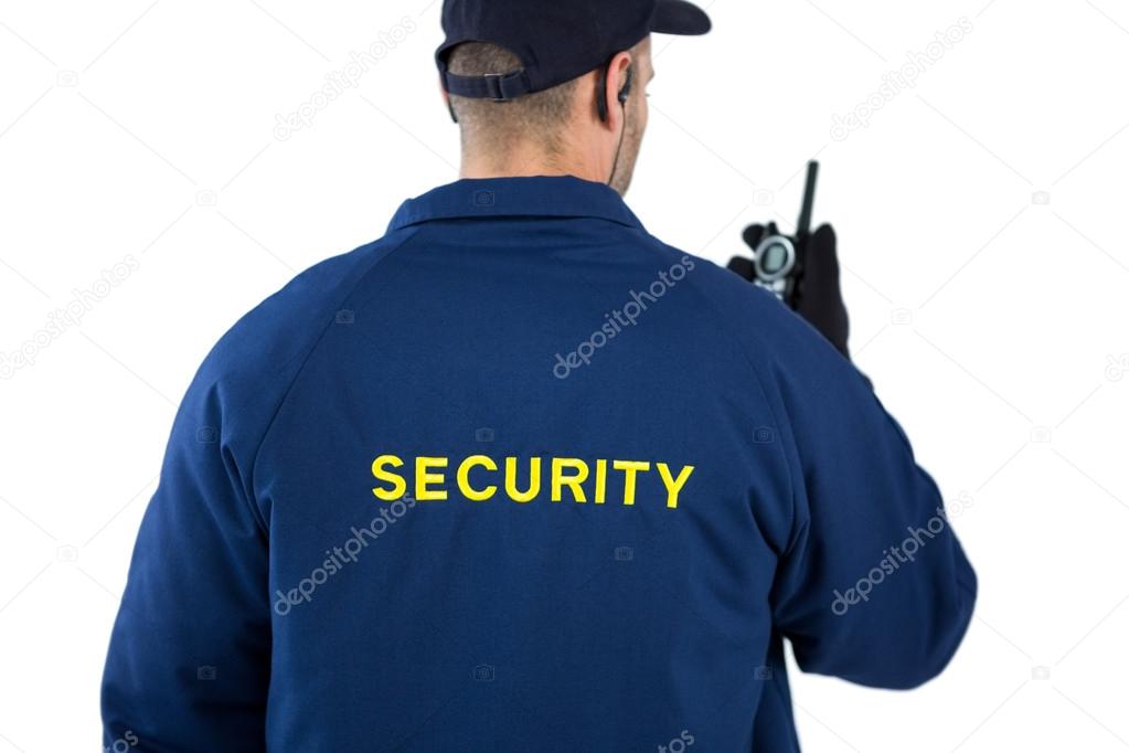 Security officer talking on walkie-talkie — Stock Photo ...
