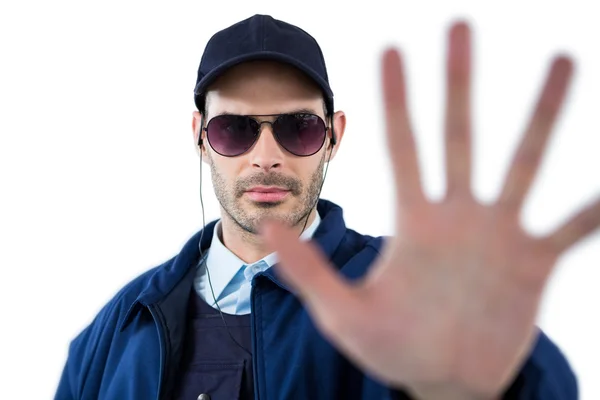 Confident security officer making stop gesture — Stock Photo ...
