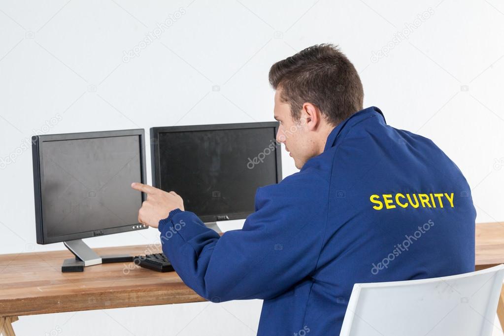 Security officer using computer — Stock Photo © Wavebreakmedia #126953702