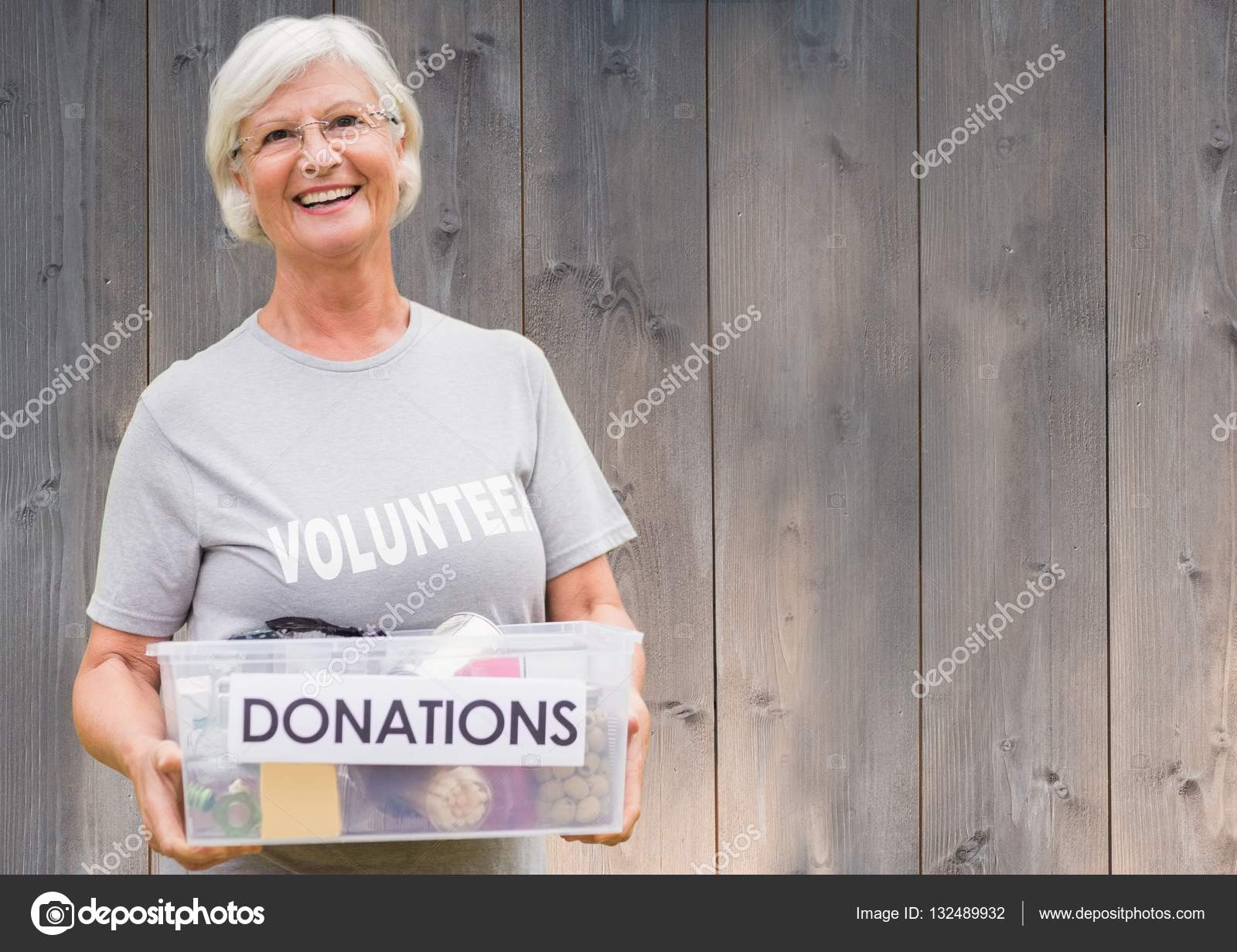 Female volunteer holding donations box Stock Photo by ©Wavebreakmedia ...