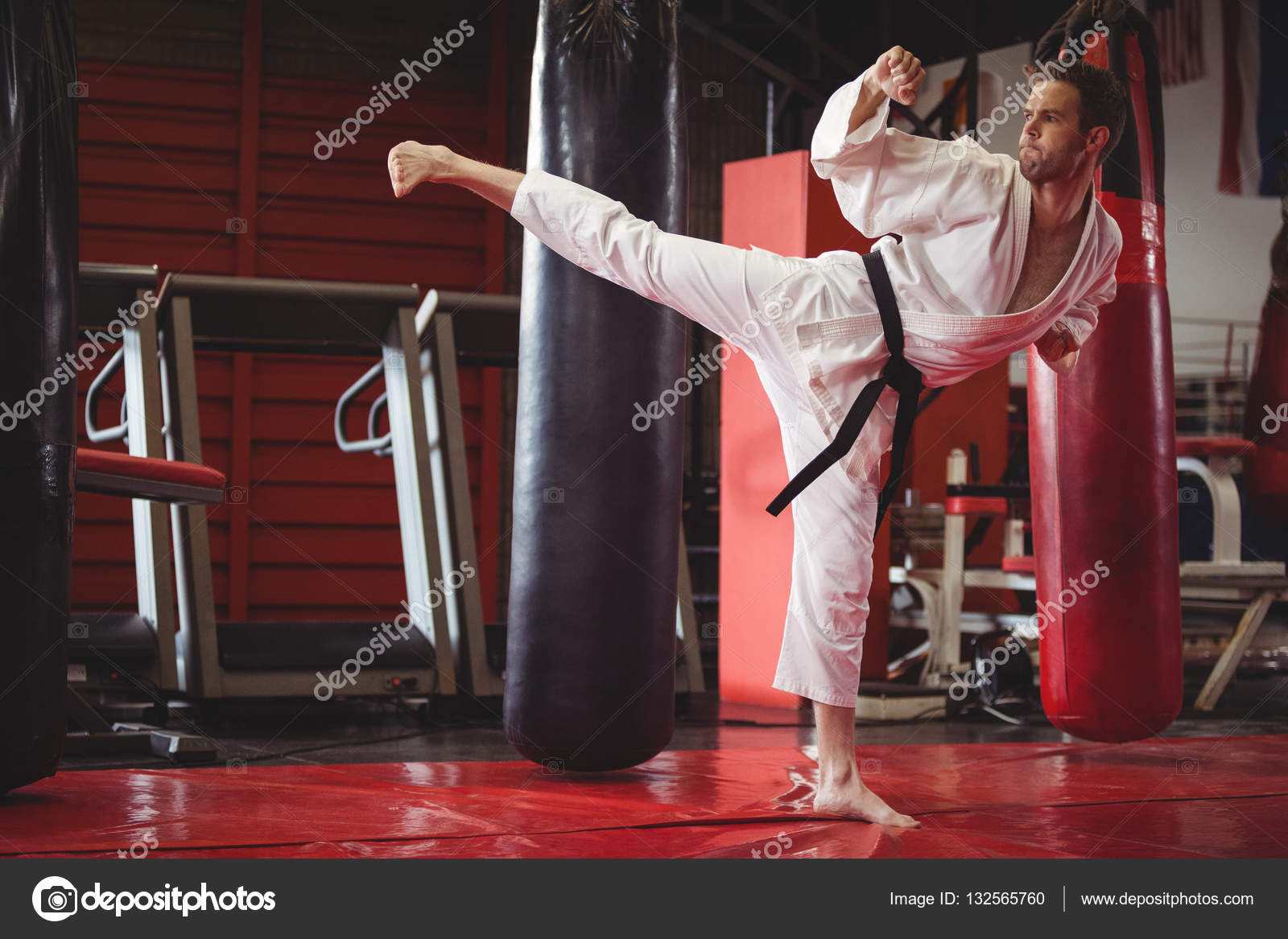 Karate player performing karate stance Stock Photo by ©Wavebreakmedia ...