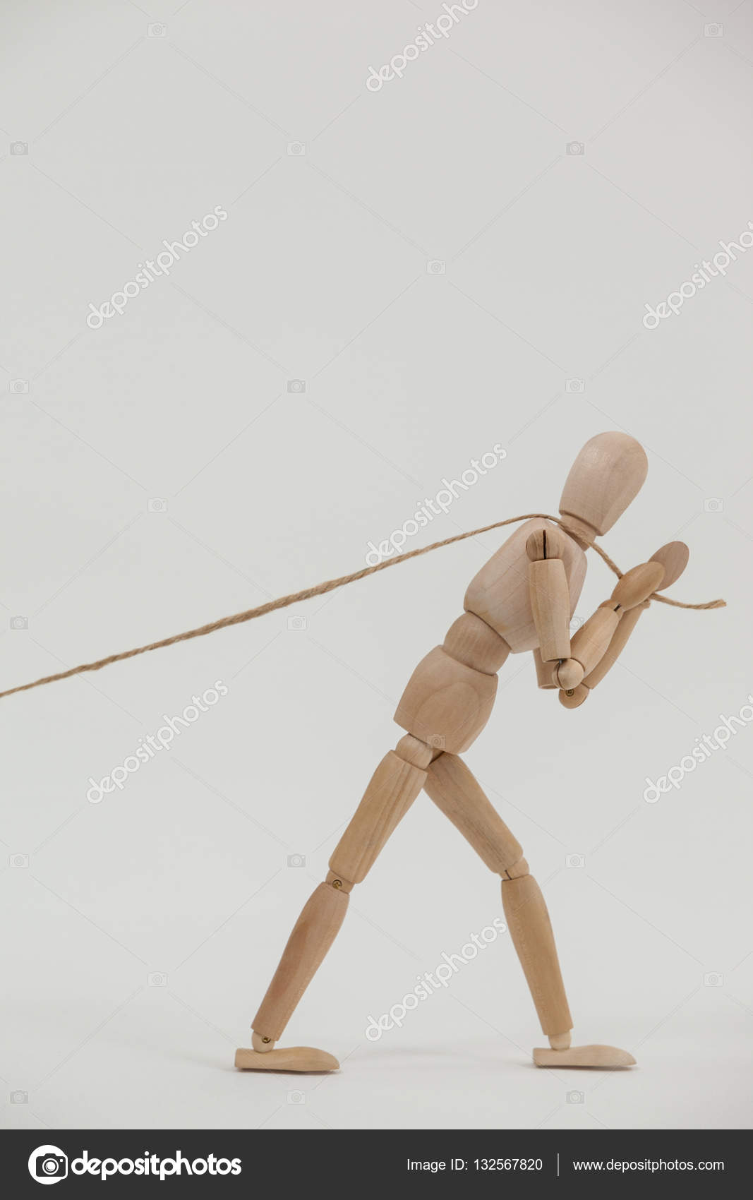 Wooden figurine pulling a rope Stock Photo by ©Wavebreakmedia 132567820