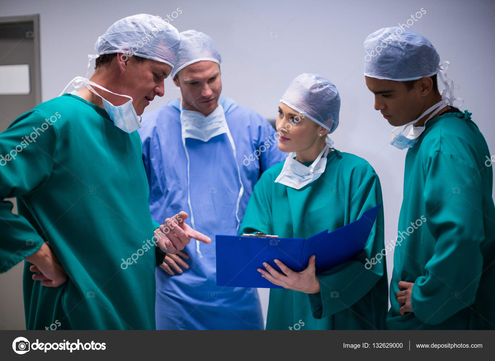 Surgeons having discussion on file — Stock Photo © Wavebreakmedia ...