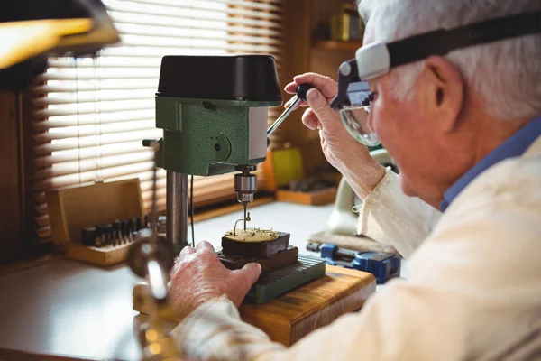 Horologist repairing a watch Stock Photo by ©Wavebreakmedia 132567112