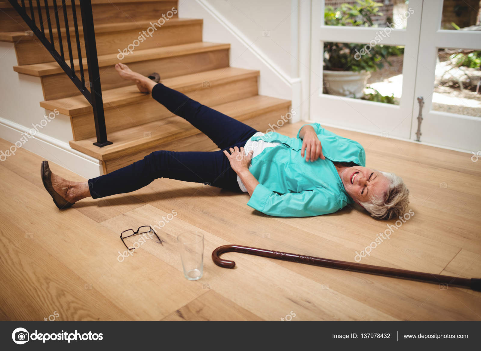 Senior woman fallen down from stairs Stock Photo by ©Wavebreakmedia ...