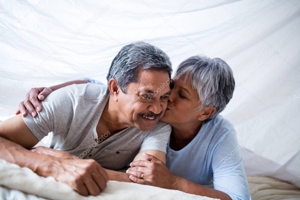 Senior woman giving a kiss on man cheeks — Stock Photo © Wavebreakmedia ... Senior woman giving a kiss on man cheeks — Stock Photo © Wavebreakmedia ...