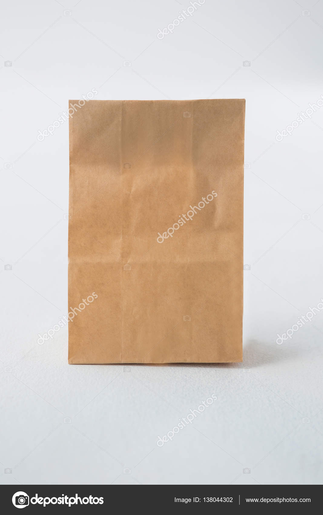 Brown paper lunch bag Stock Photo by ©Wavebreakmedia 138044302