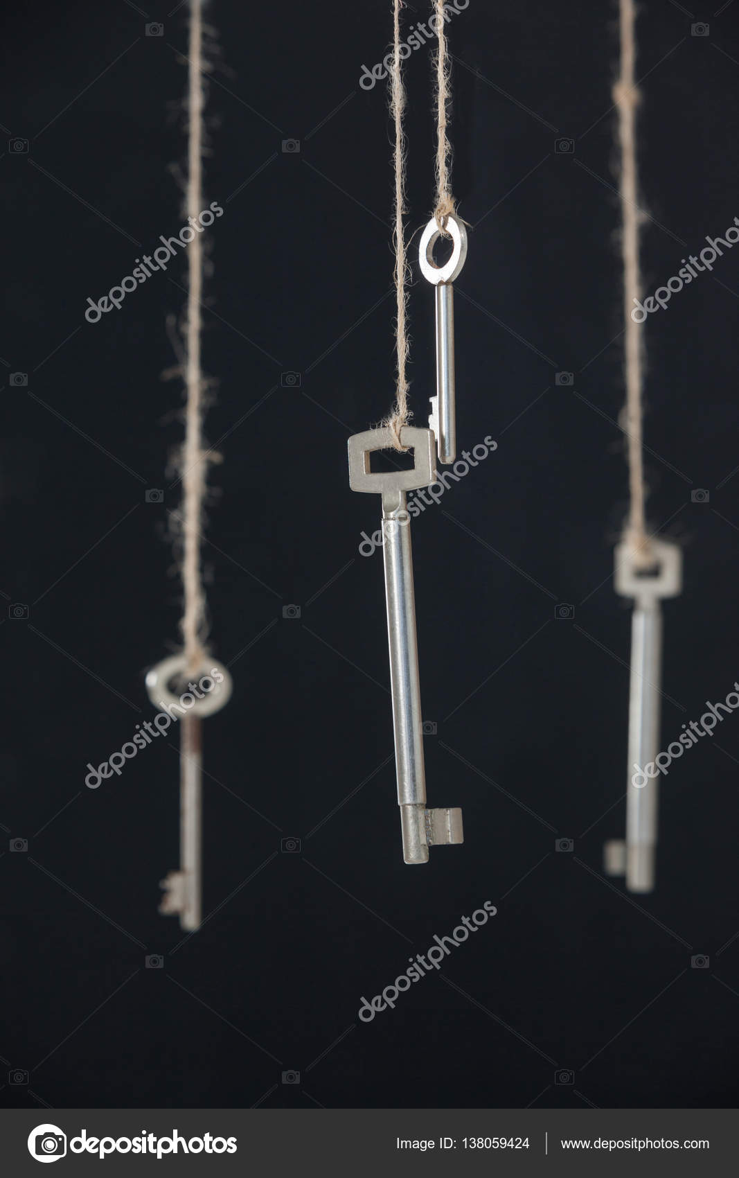 Keys hanging on strings Stock Photo by ©Wavebreakmedia 138059424