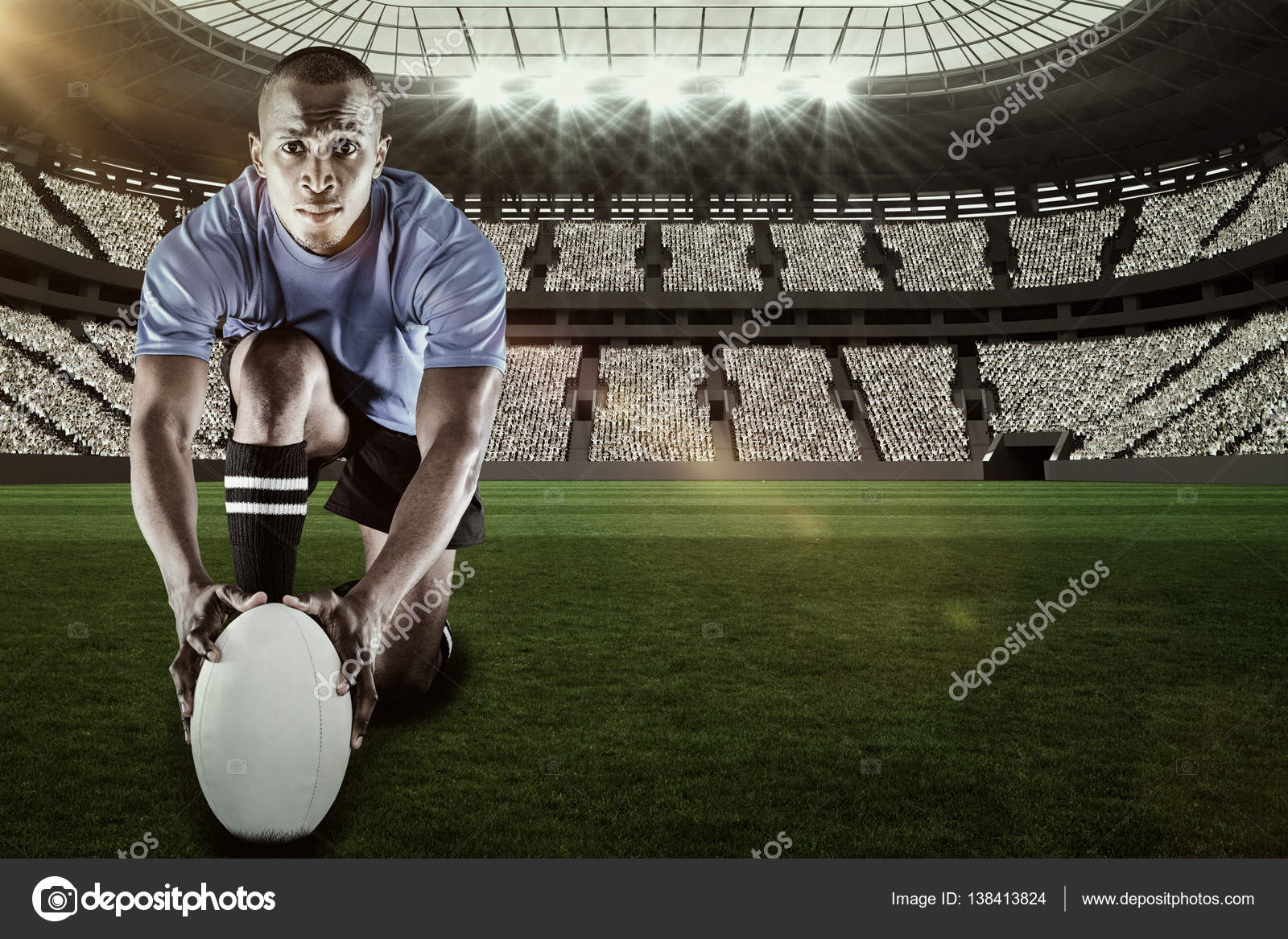 Rugby player kneeling and holding ball — Stock Photo © Wavebreakmedia ...