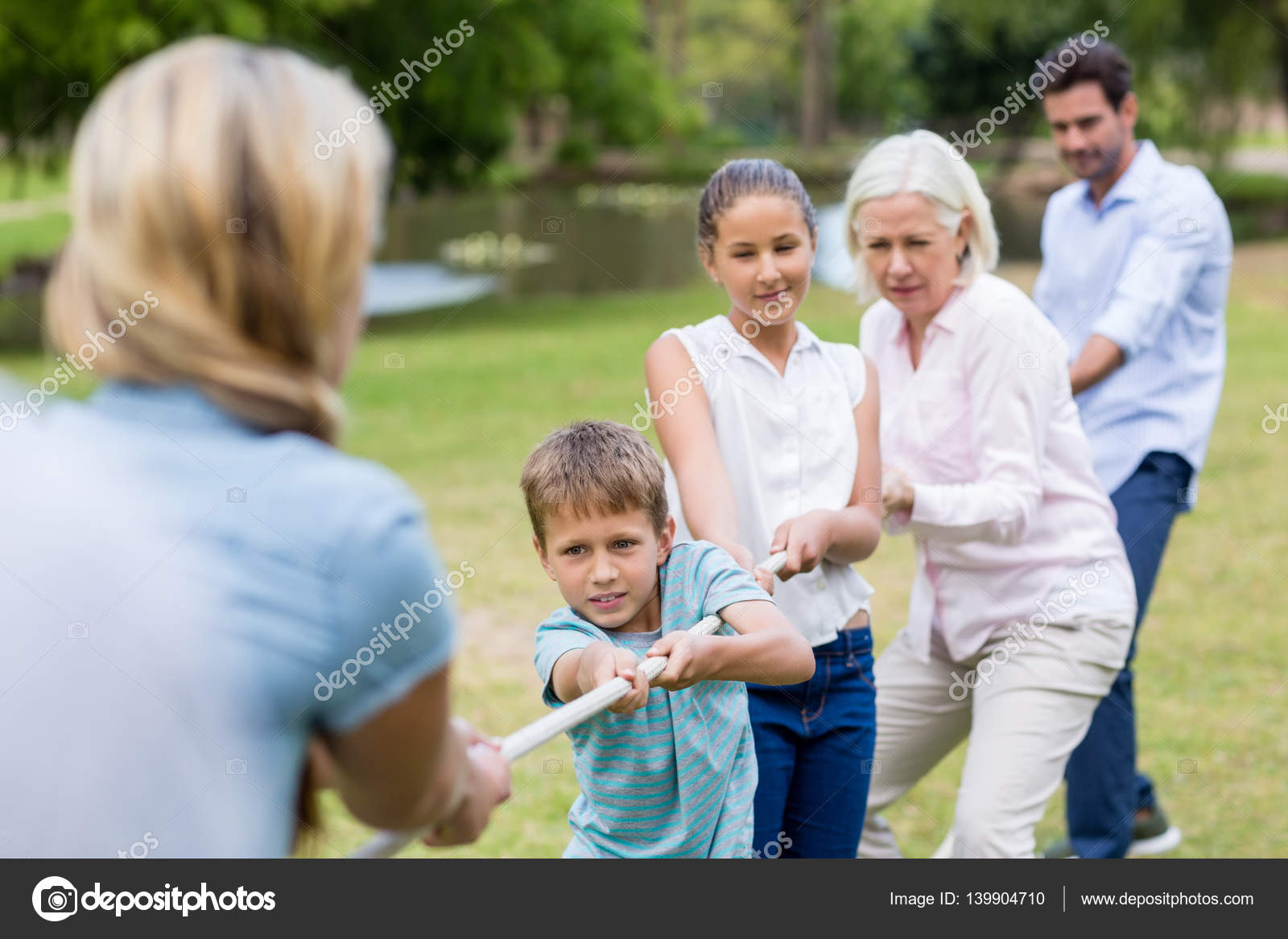 Multi-generation family in park — Stock Photo © Wavebreakmedia #139904710