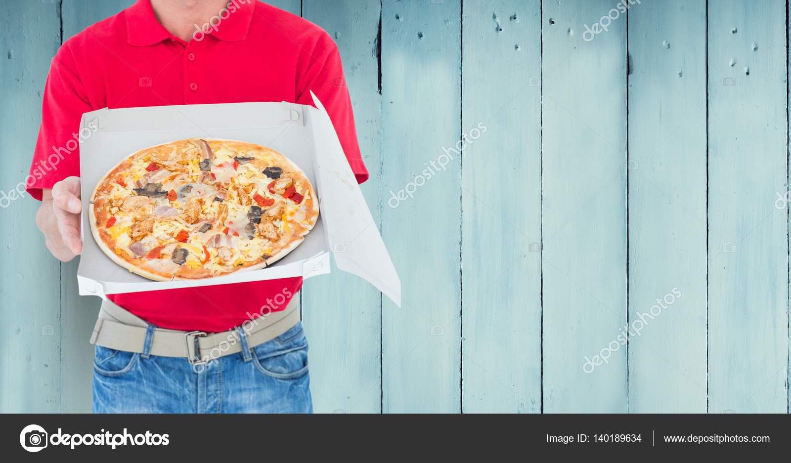 Delivery man holding pizza box Stock Photo by ©Wavebreakmedia 140189634