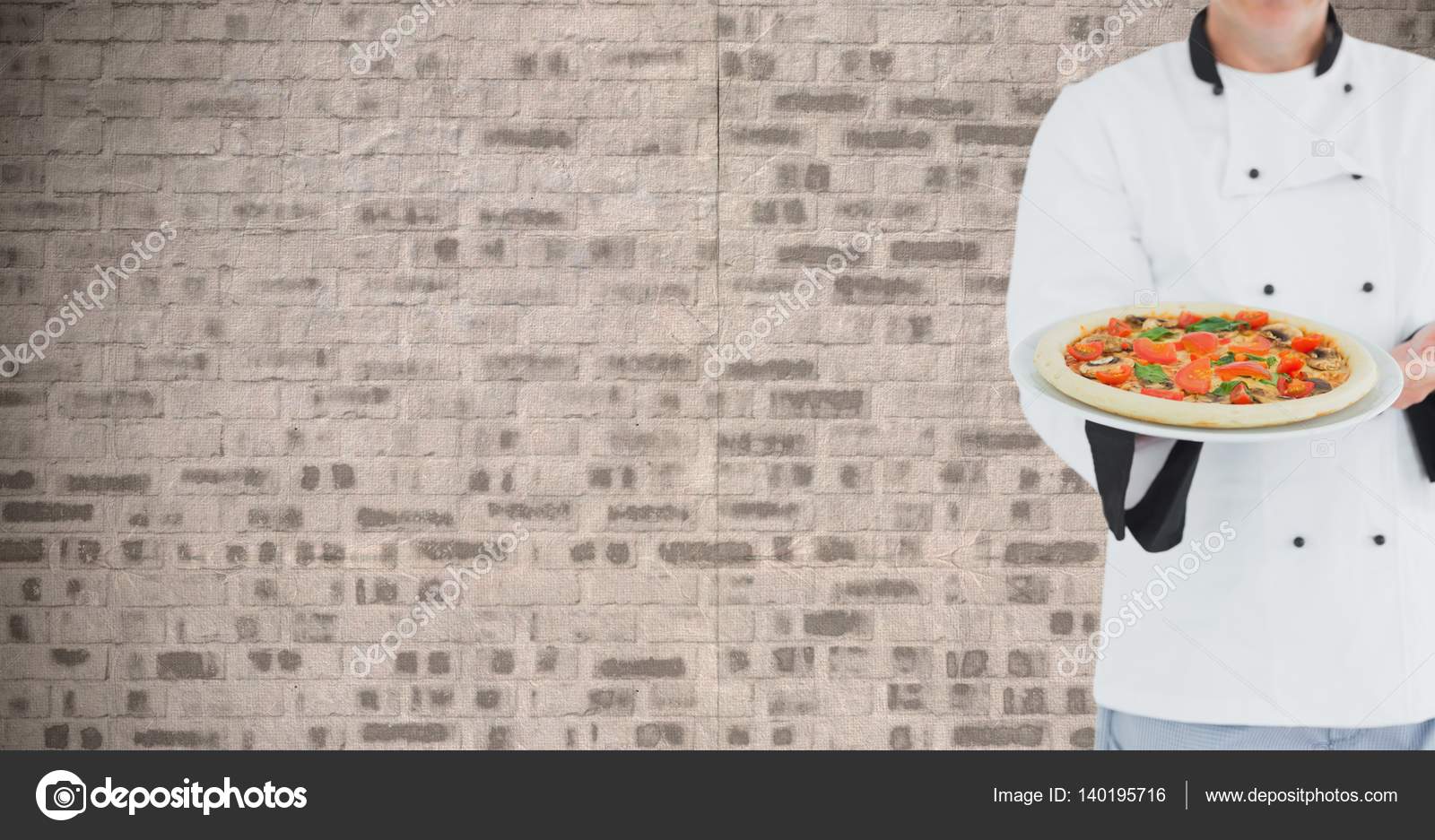 Chef holding pizza in plate Stock Photo by ©Wavebreakmedia 140195716