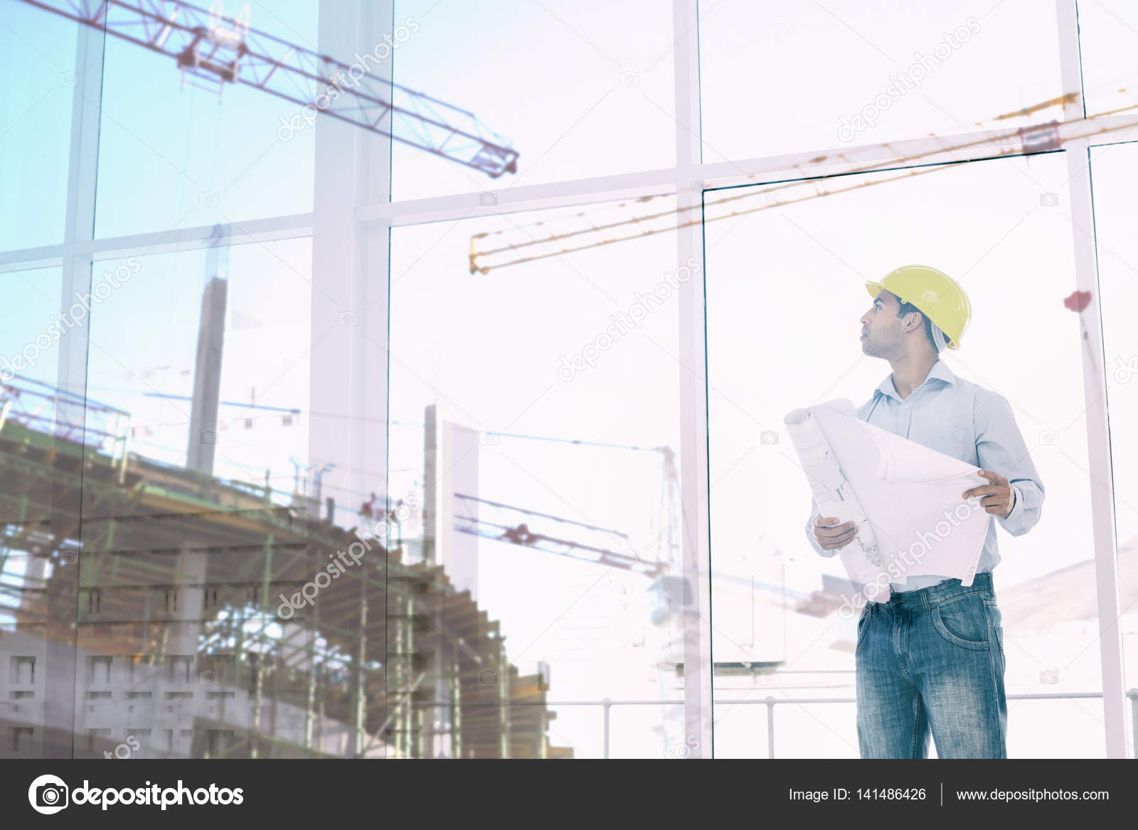 Man looking at building construction site Stock Photo by ...