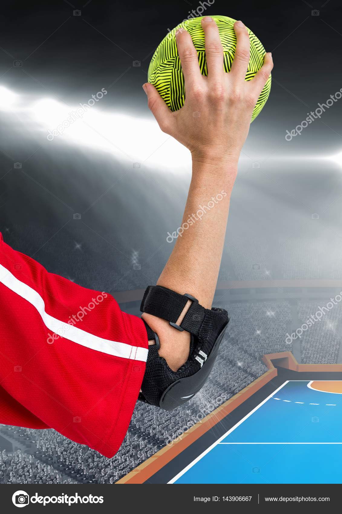 Athlete throwing handball against stadium in background Stock Photo by ...