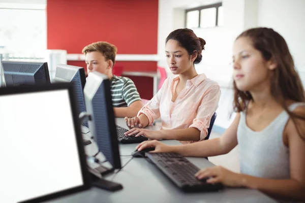 Smiling students using computer — Stock Photo © Wavebreakmedia #98083244