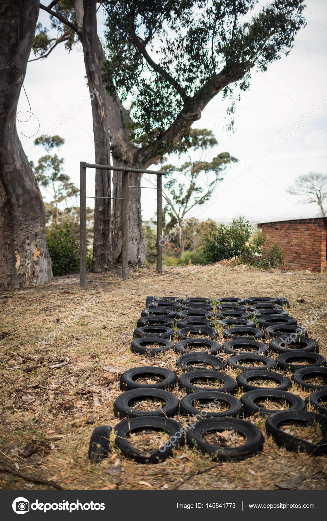 Boot camp with tyres obstacle course and fitness trial — Stock Photo ...