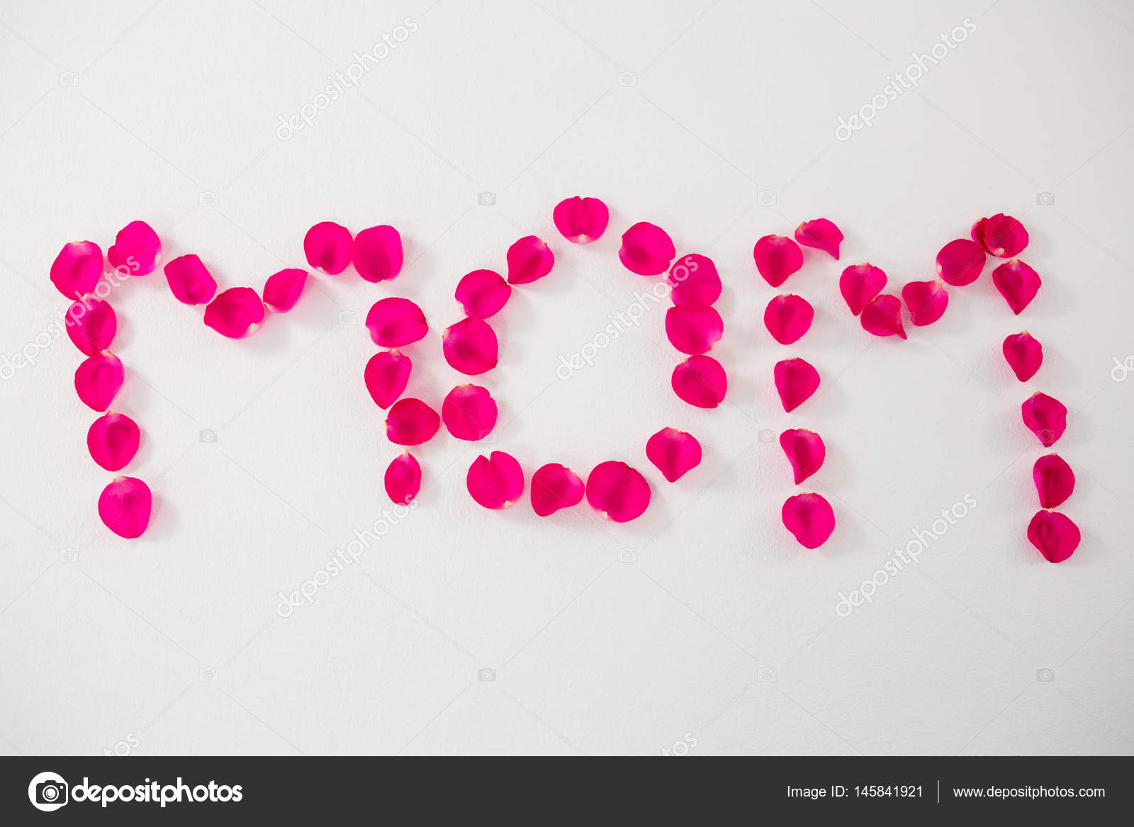 Rose petals forming alphabet mom against white background — Stock Photo ...