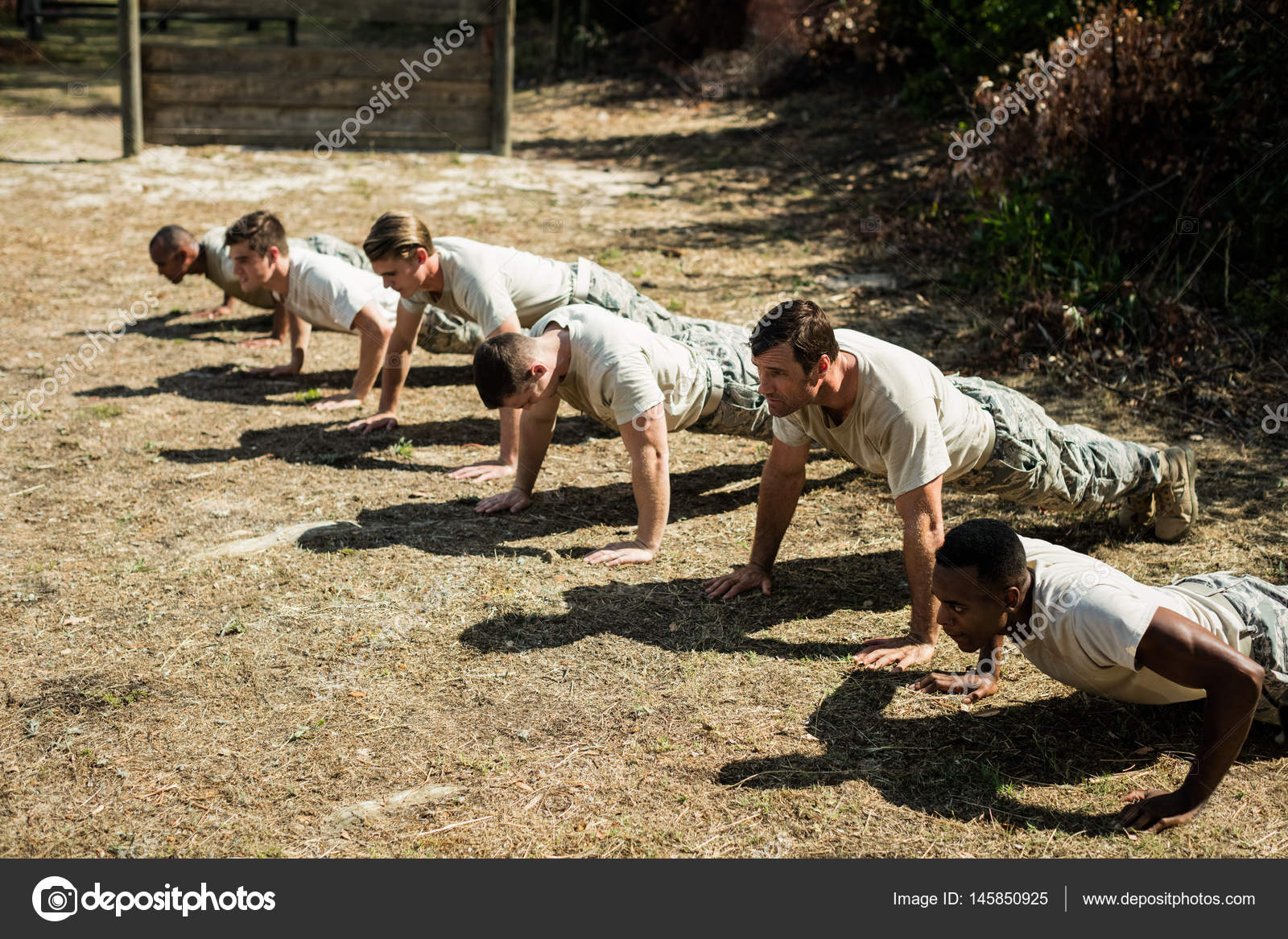 Soldiers performing pushup exercise Stock Photo by ©Wavebreakmedia ...